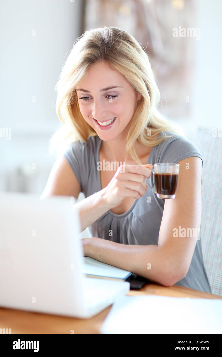 Woman working at home on laptop computer Stock Photo - Alamy