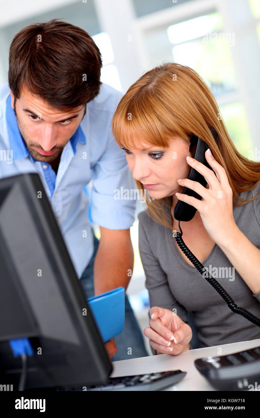 Business people working on desktop computer Stock Photo - Alamy