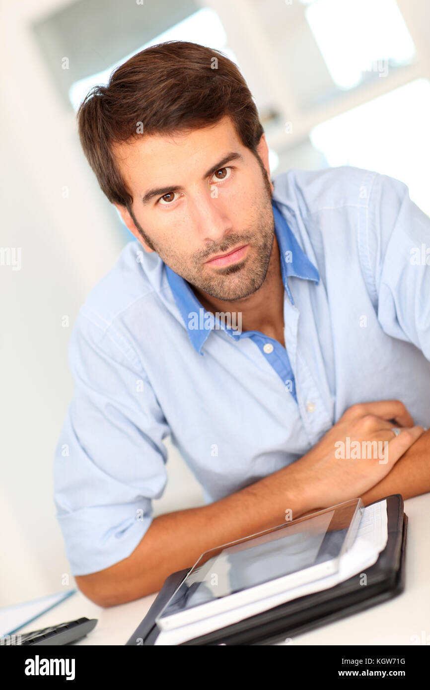 Portrait of office worker using electronic tablet Stock Photo - Alamy