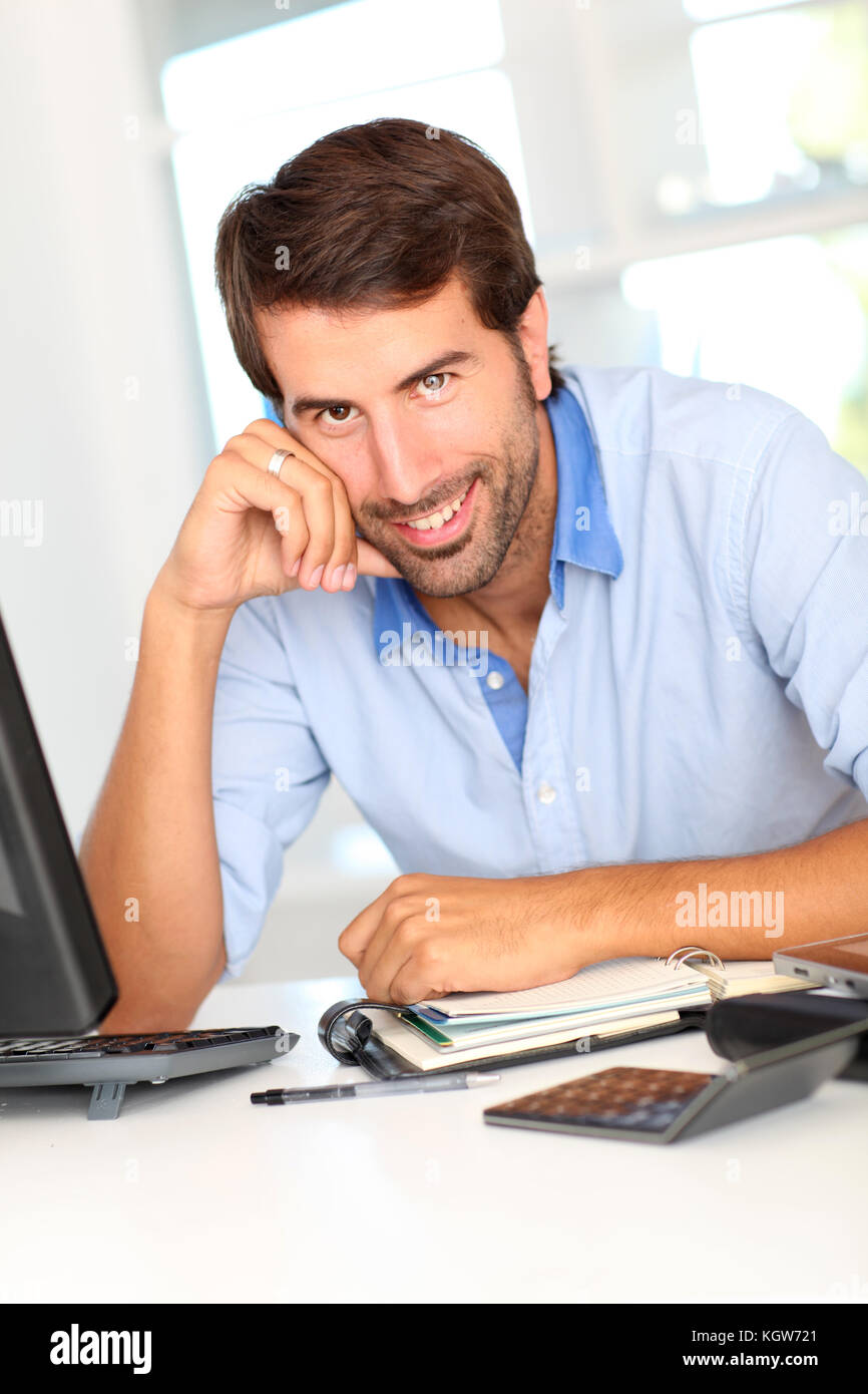 Portrait of happy office worker Stock Photo - Alamy