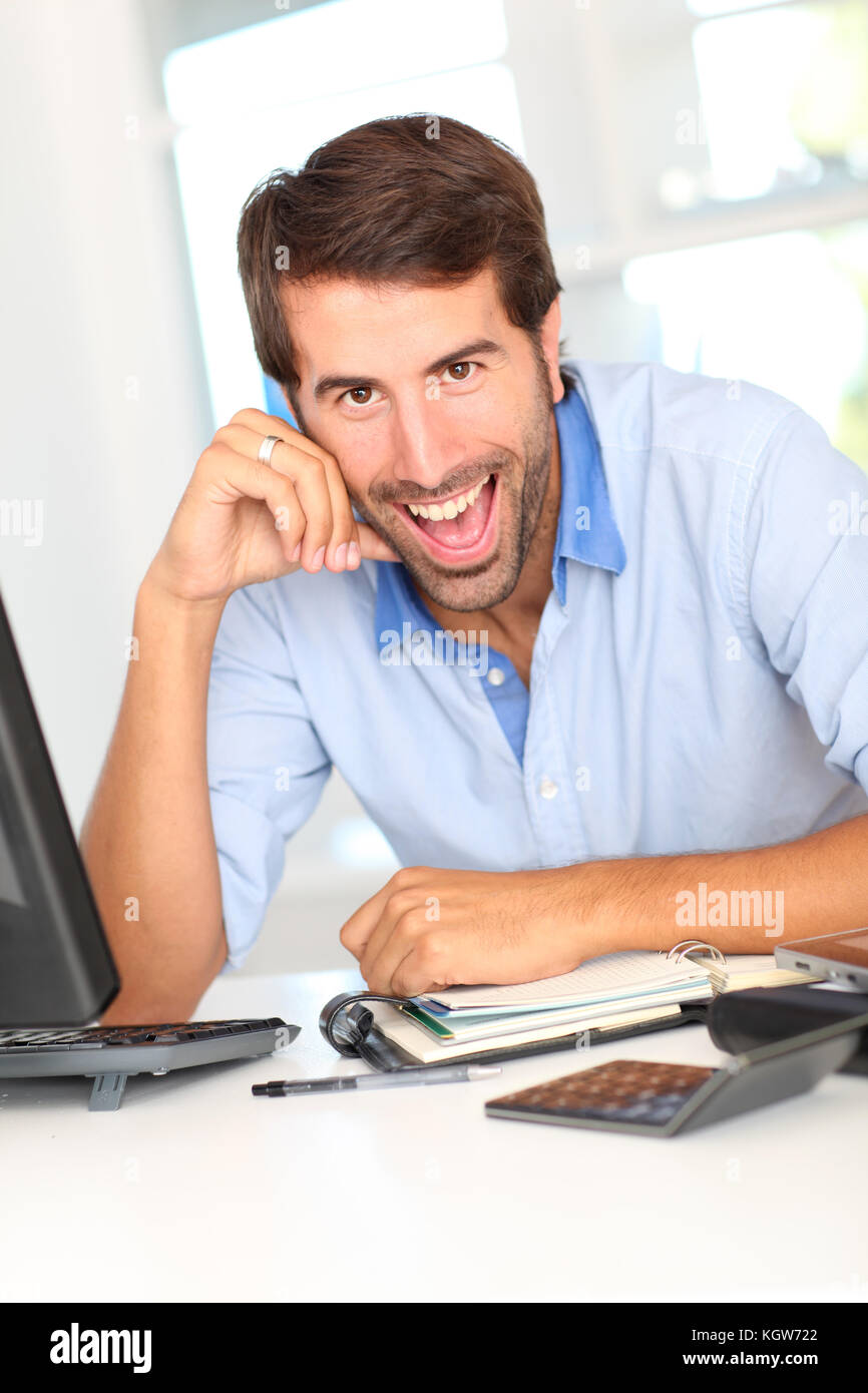 Portrait of happy office worker Stock Photo - Alamy