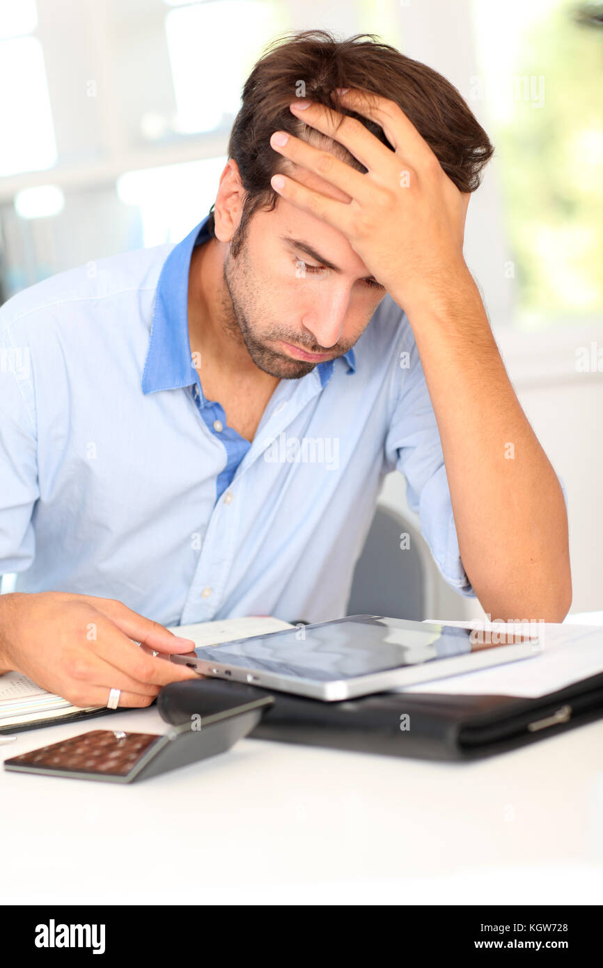 Office worker having hard time with project Stock Photo - Alamy