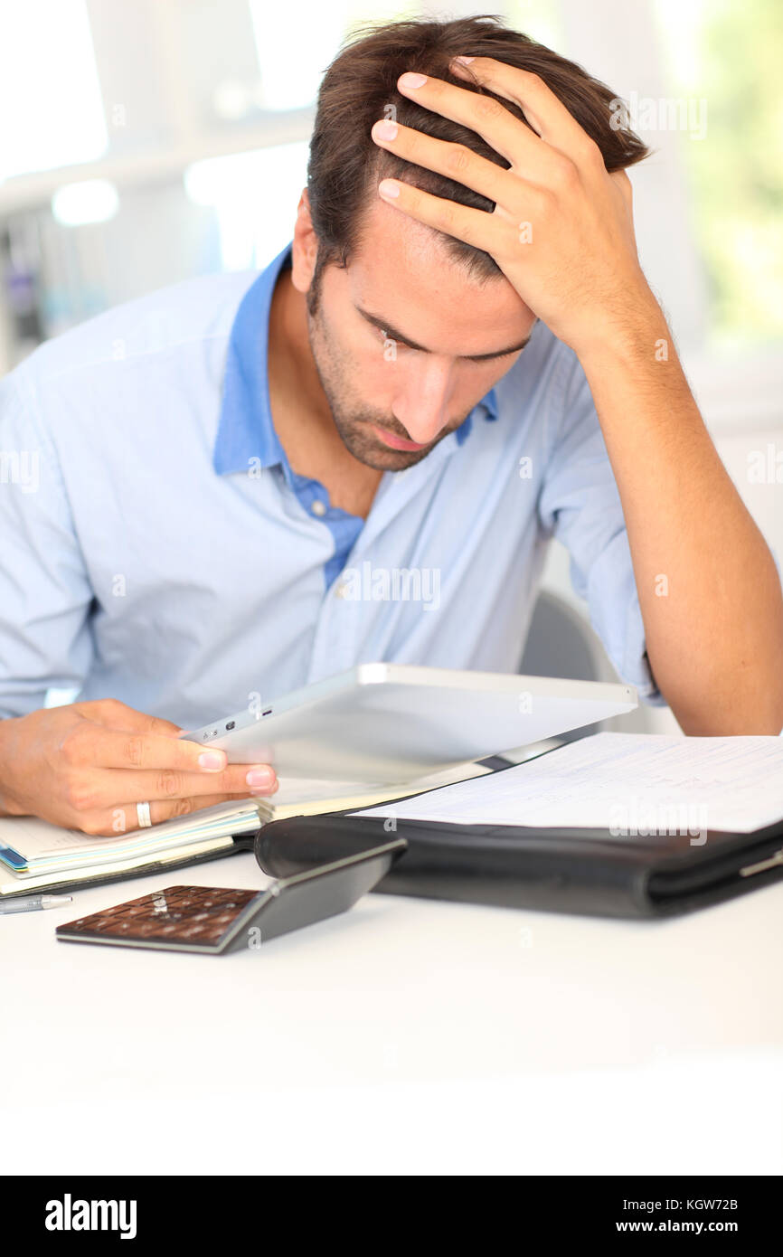 Office worker having hard time with project Stock Photo - Alamy