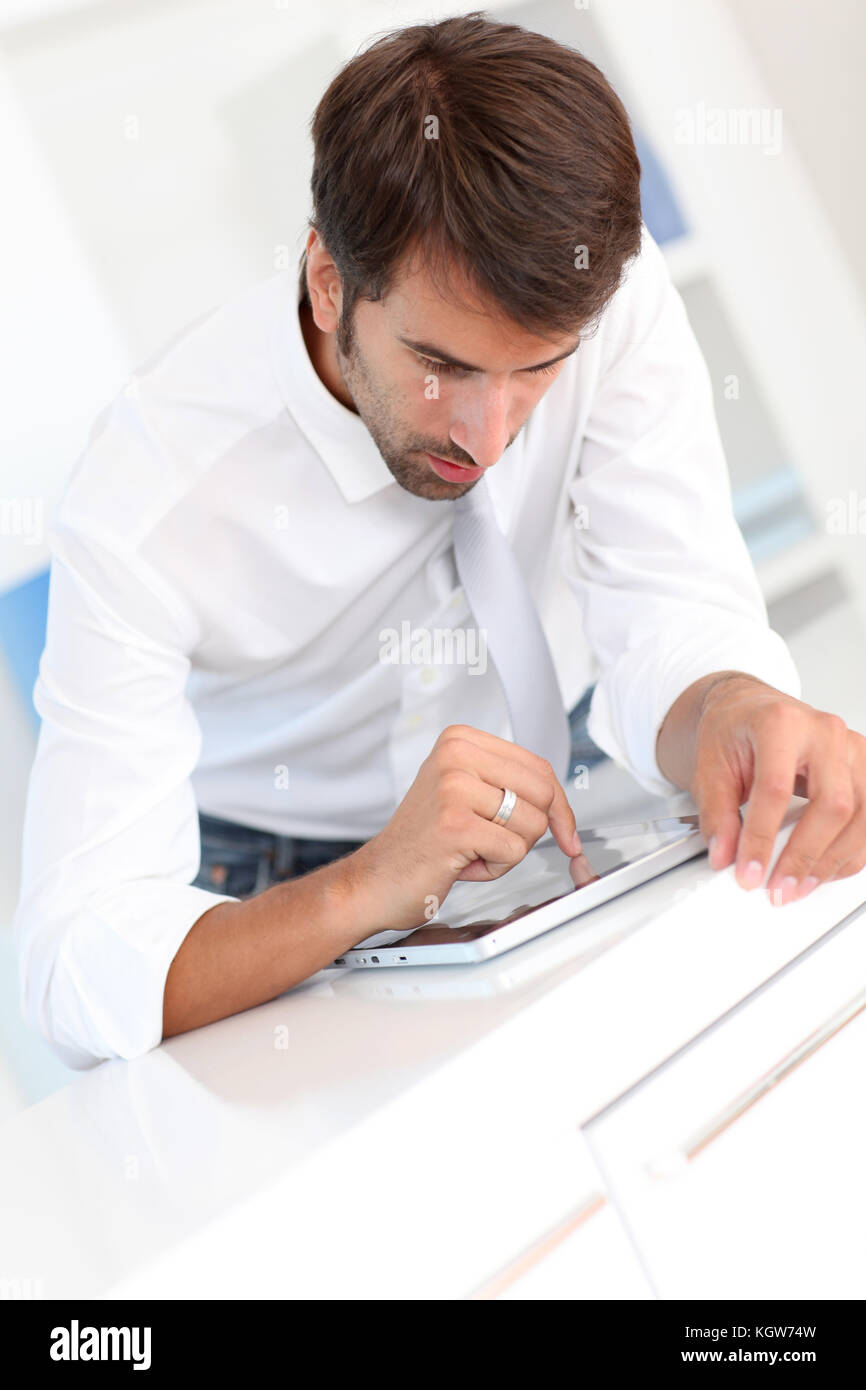 Office worker using electronic tablet Stock Photo - Alamy