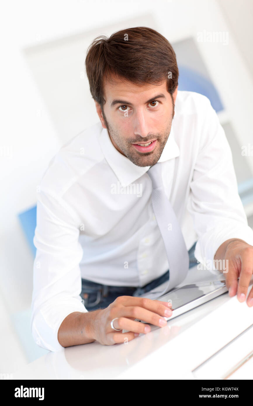 Office worker using electronic tablet Stock Photo - Alamy