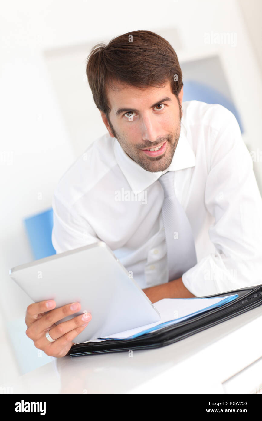 Office worker using electronic tablet Stock Photo - Alamy