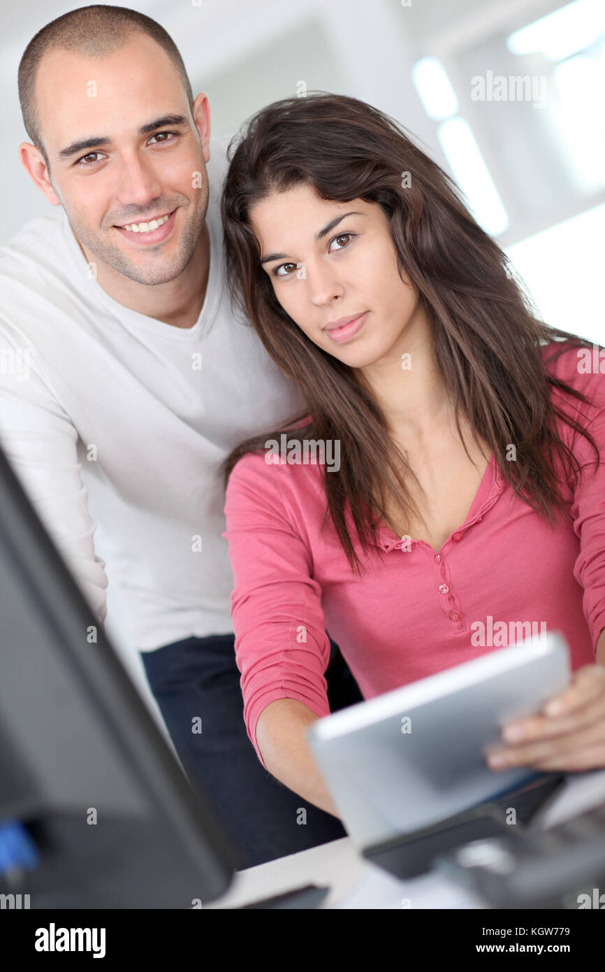 Office workers using electronic tablet Stock Photo - Alamy