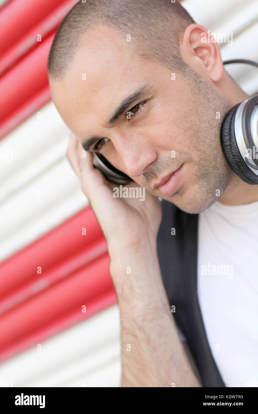 Young man with music headphones Stock Photo - Alamy