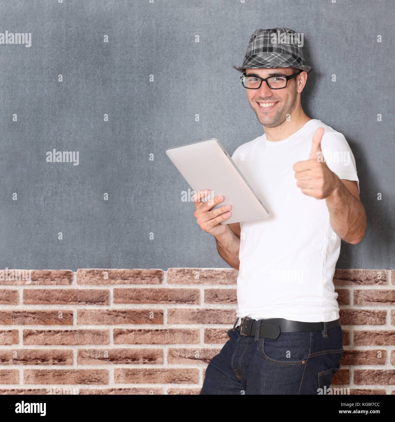 Stylish guy using electronic tablet Stock Photo - Alamy
