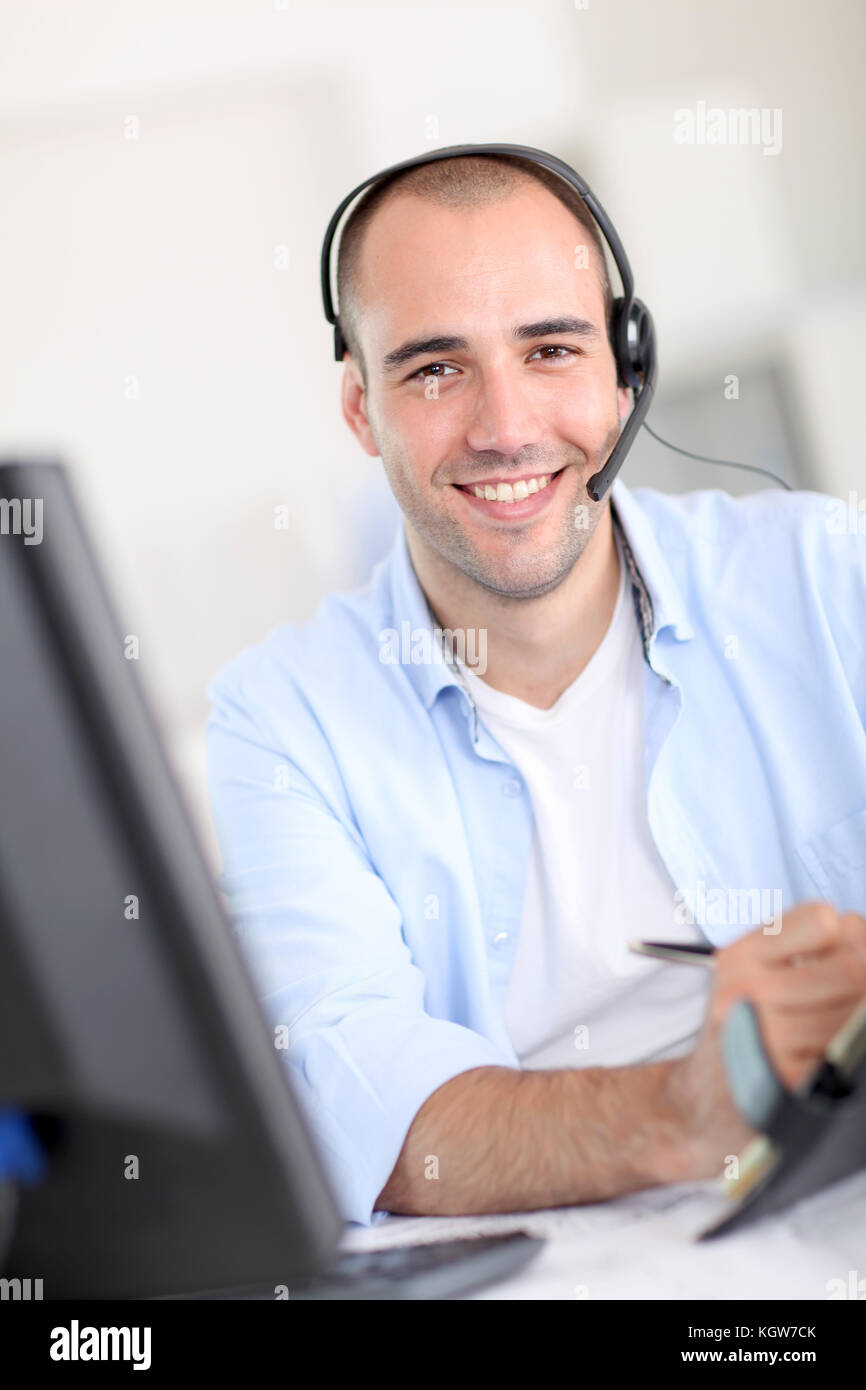 Portrait of cheerful customer service employee Stock Photo - Alamy
