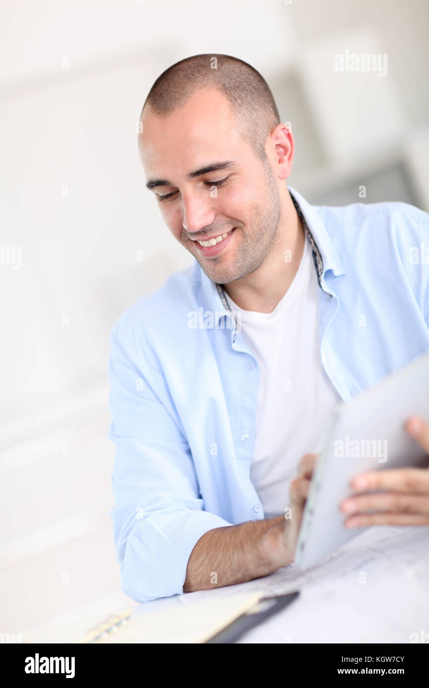 Office worker using electronic tablet Stock Photo - Alamy