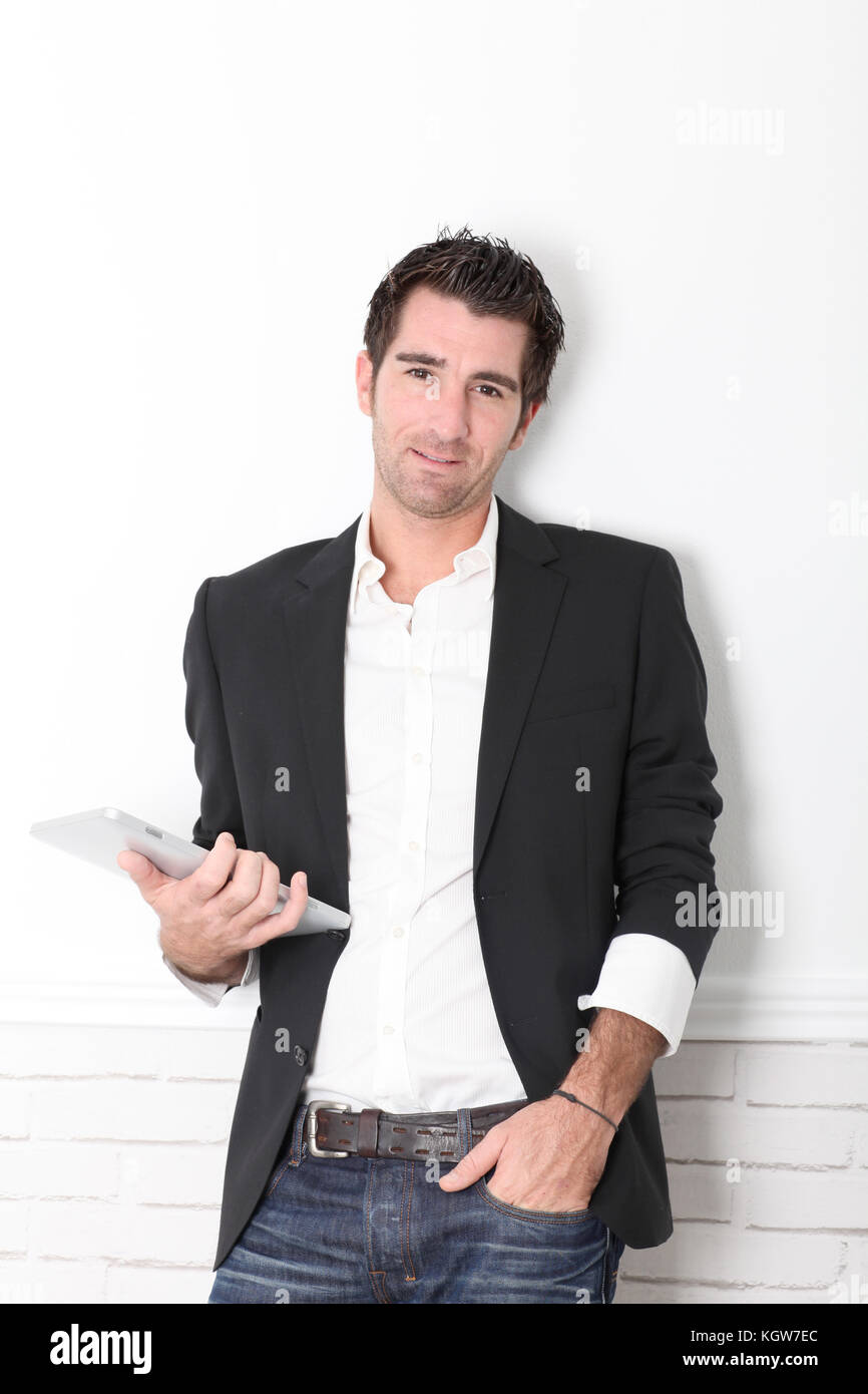 Man using electronic tablet Stock Photo - Alamy