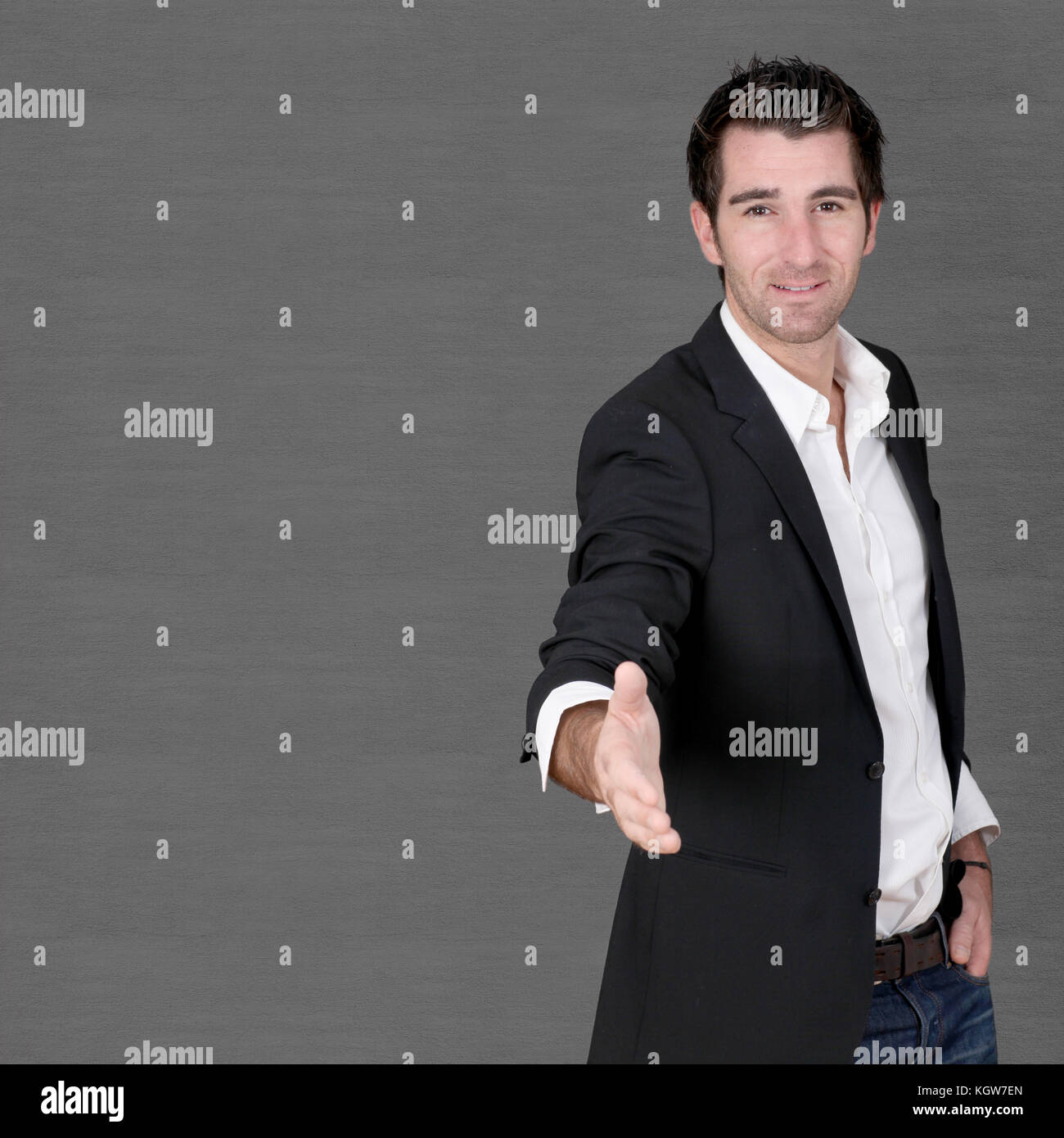 Salesman giving hand for handshake Stock Photo - Alamy