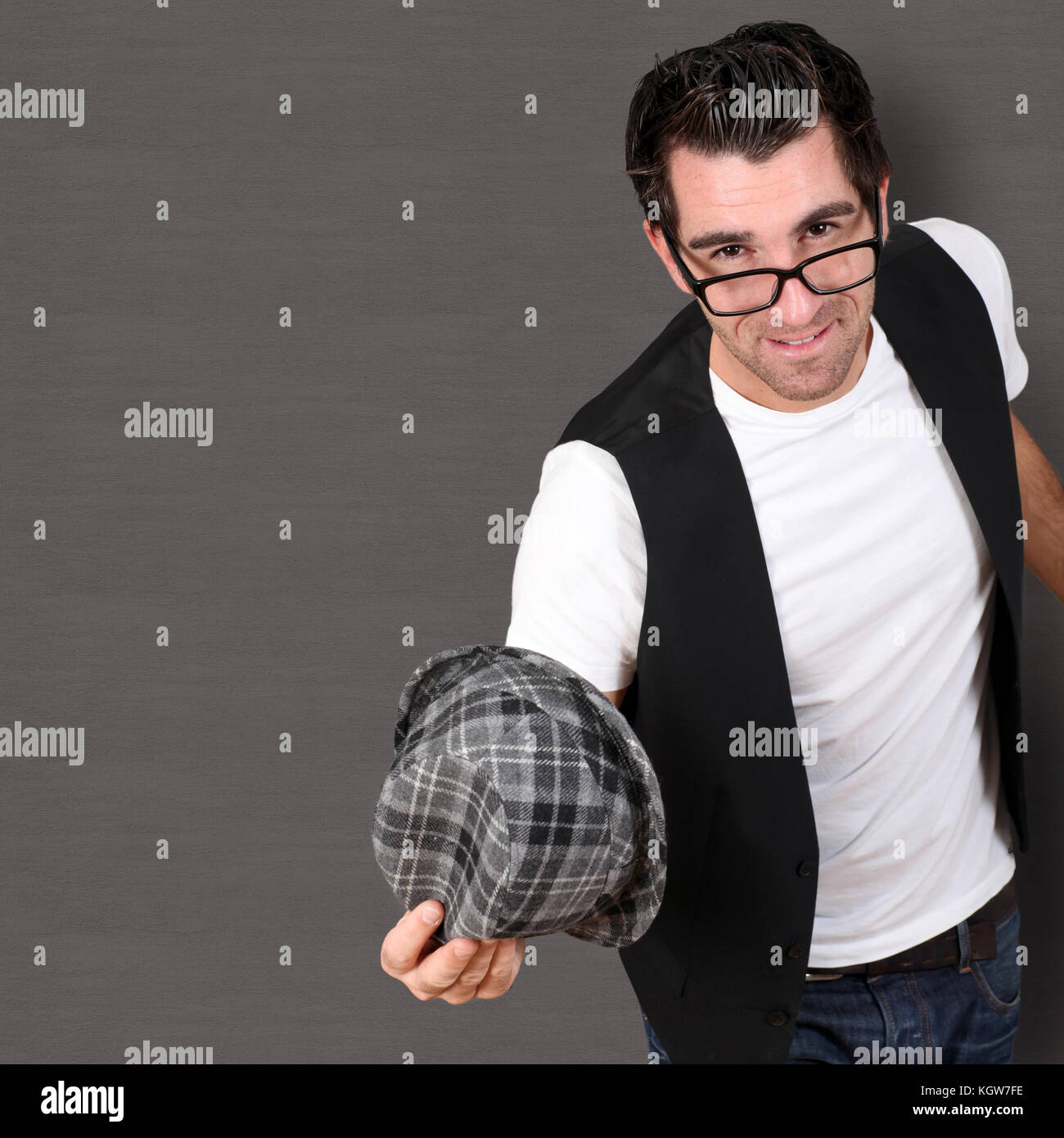 Man holding hat for greetings Stock Photo - Alamy