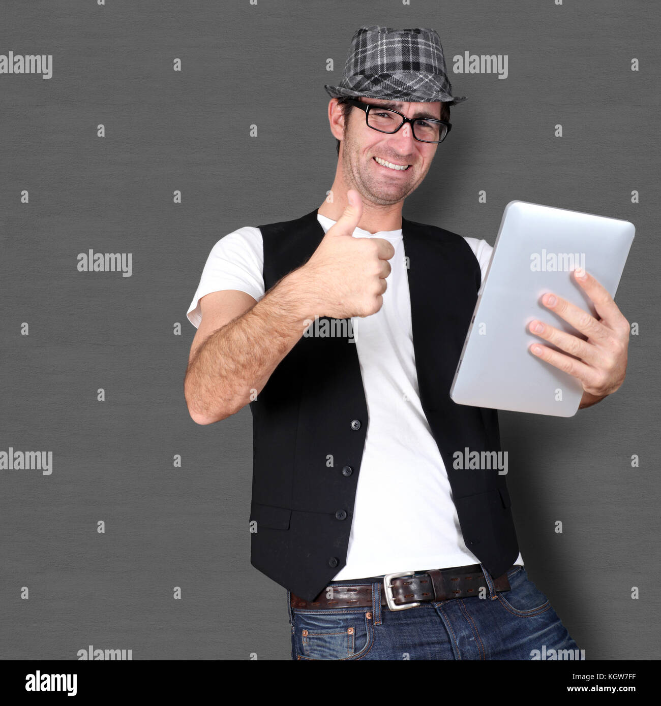 Funny guy using electronic tablet Stock Photo - Alamy