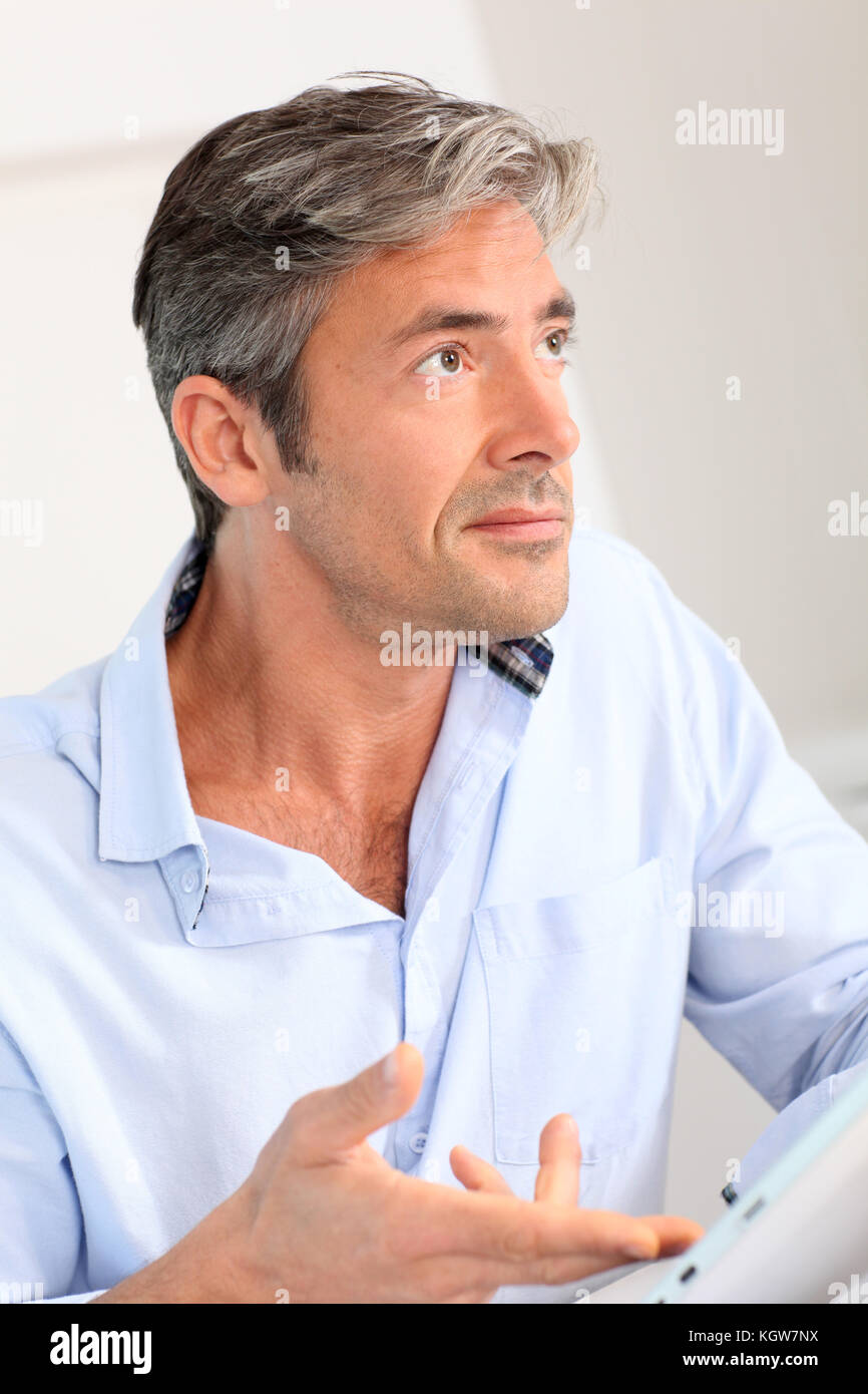 Office worker using electronic tablet Stock Photo - Alamy