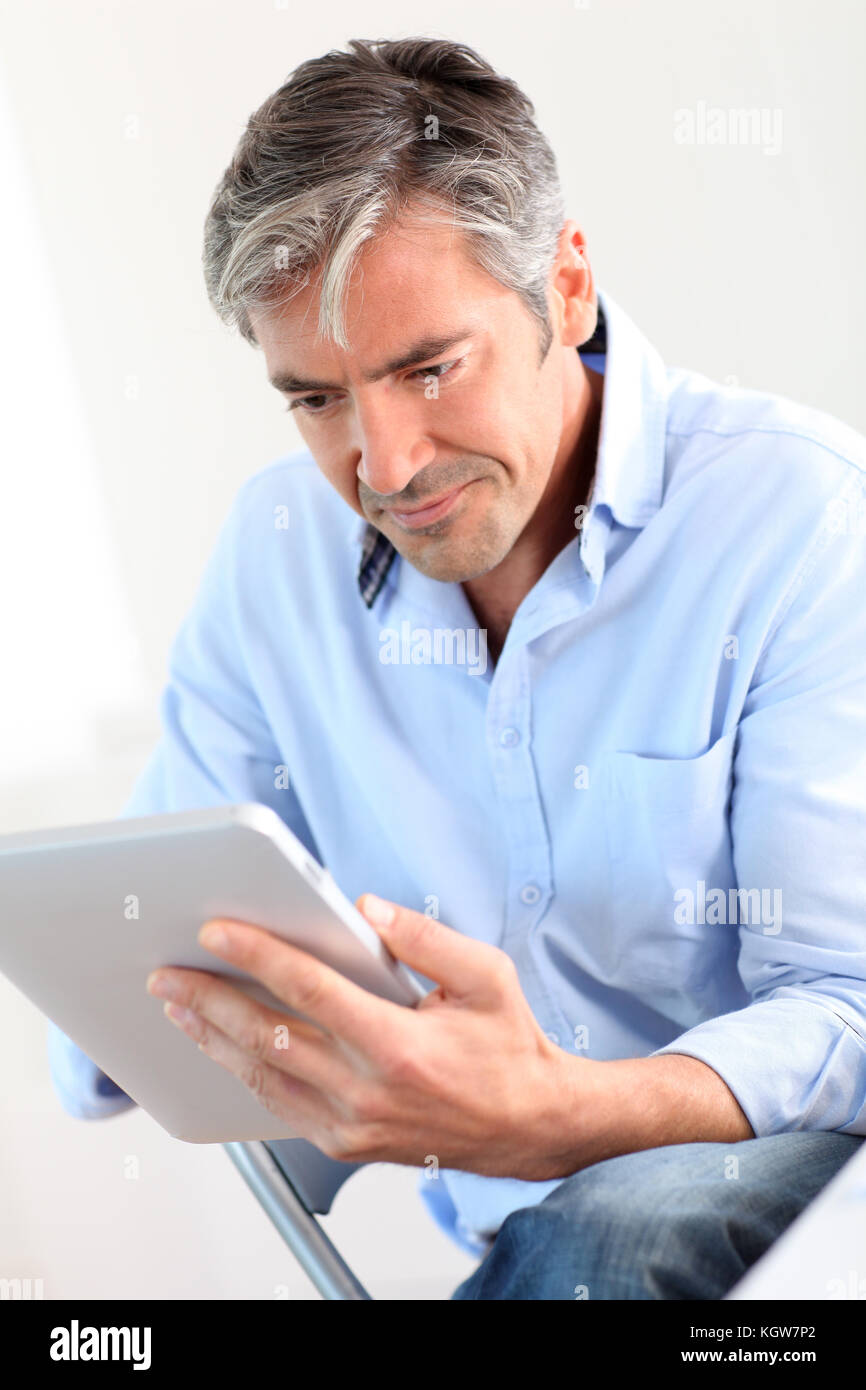 Office worker using electronic tablet Stock Photo - Alamy