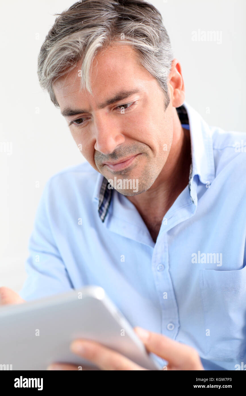 Office worker using electronic tablet Stock Photo - Alamy