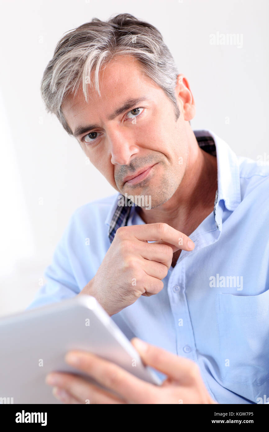 Office worker using electronic tablet Stock Photo - Alamy