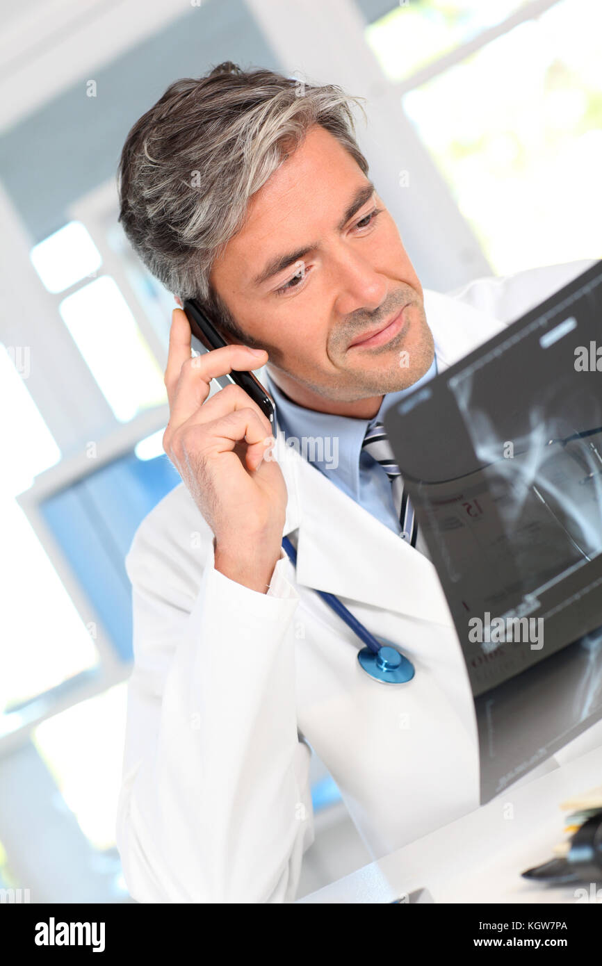 Doctor calling patient to give medical results Stock Photo - Alamy