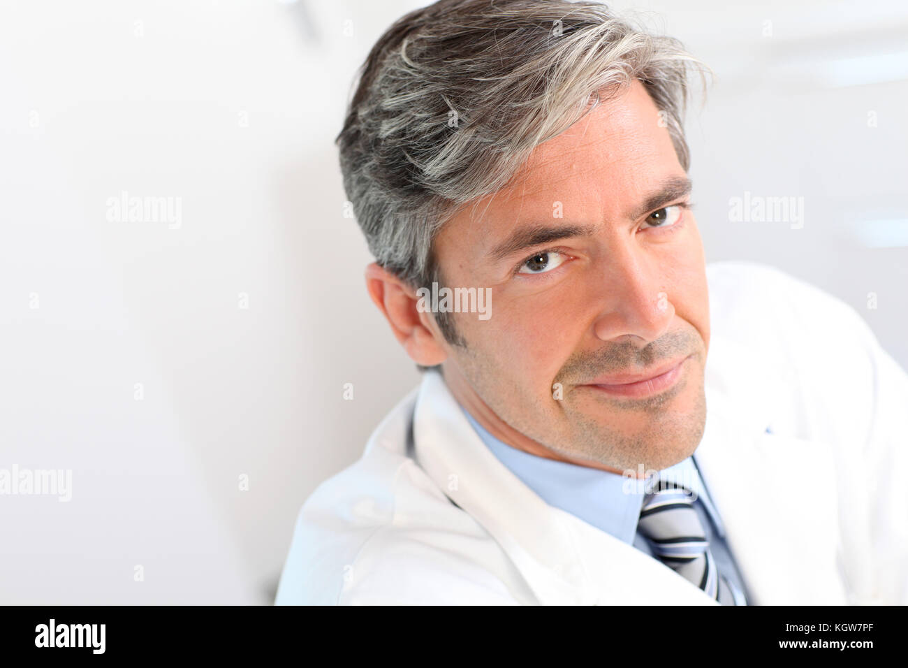 Portrait of handsome doctor Stock Photo - Alamy