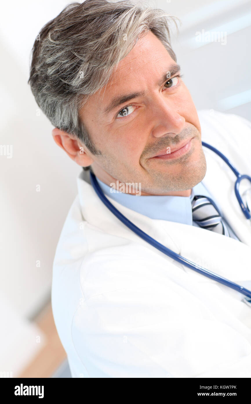 Portrait of handsome doctor Stock Photo - Alamy