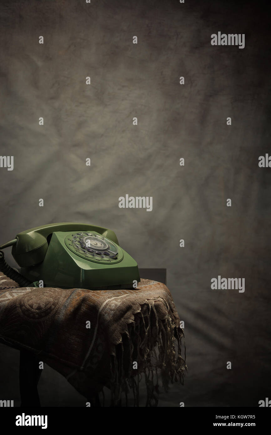 Vintage old phone on the table , still life Stock Photo - Alamy