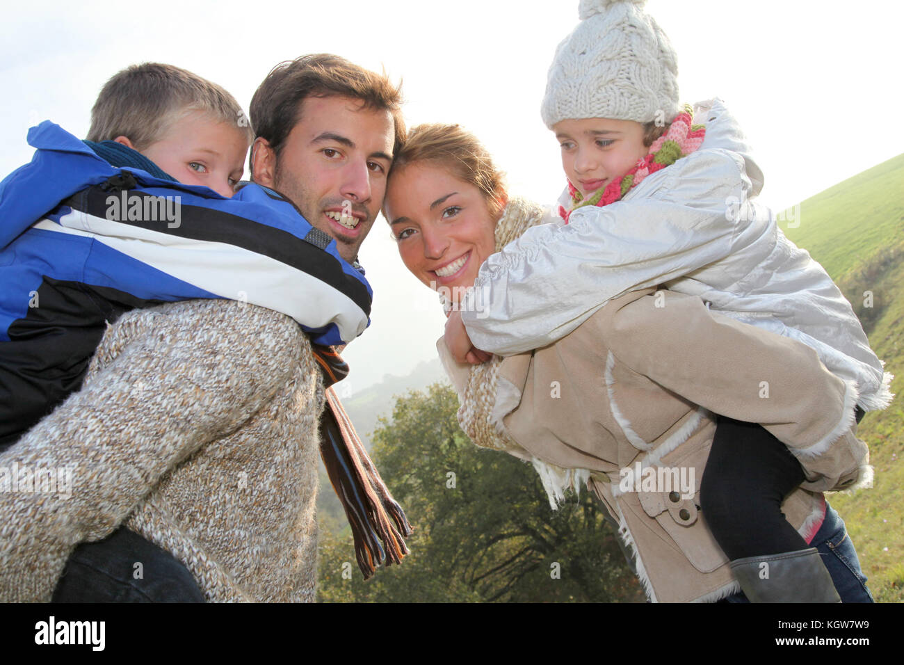 Family of 4 people in countryside Stock Photo - Alamy
