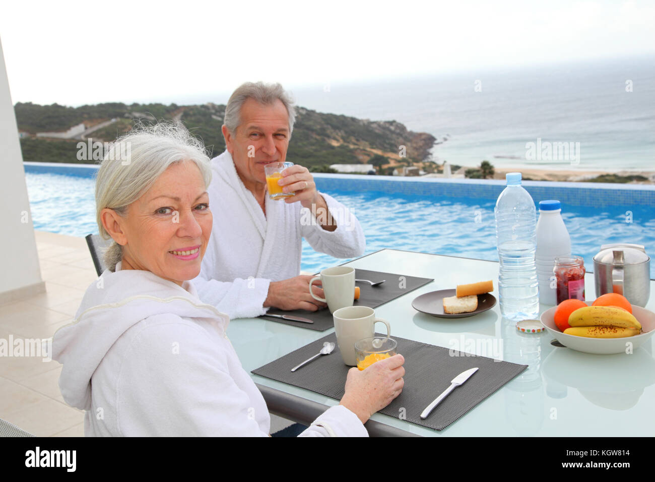 Senior couple having breakfast outside Stock Photo - Alamy