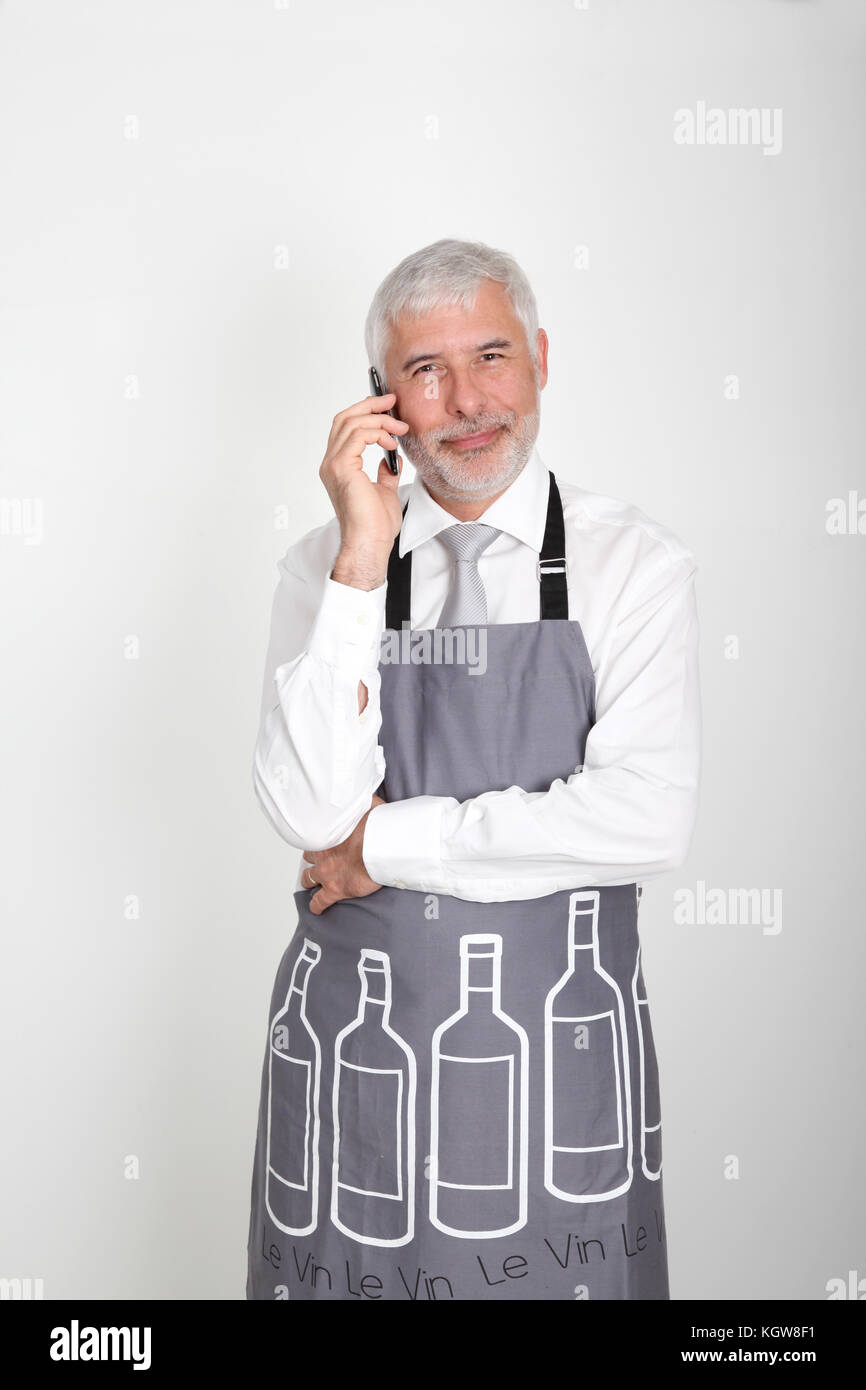 Wine waiter talking on the phone Stock Photo - Alamy