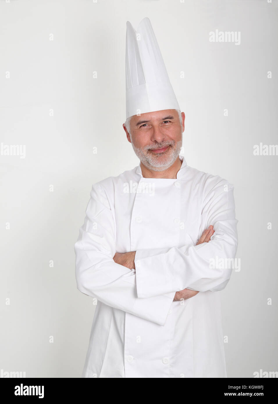 Senior chef with arms crossed Stock Photo - Alamy