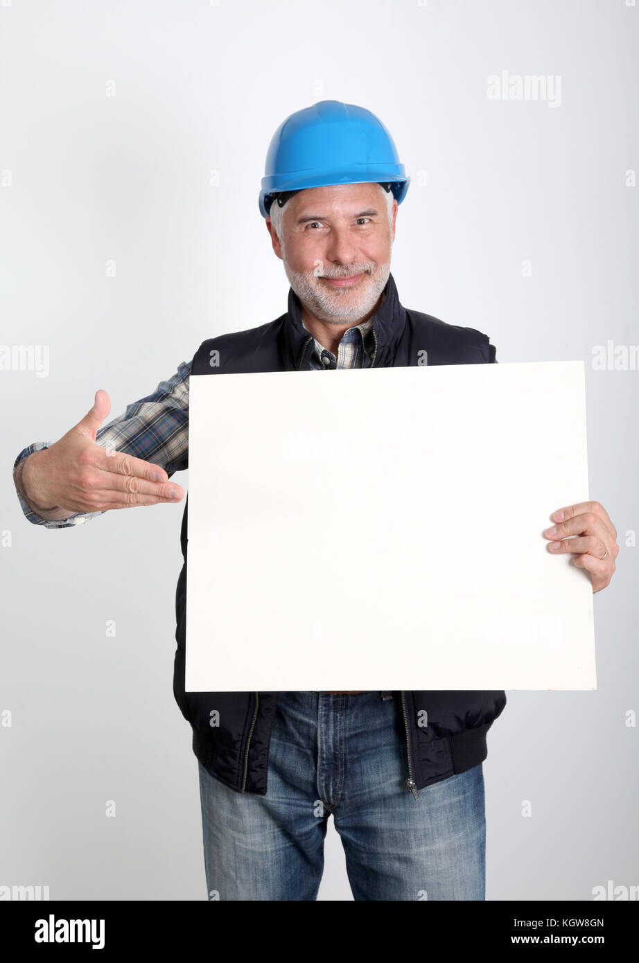 Property developer showing house for sale sign Stock Photo - Alamy