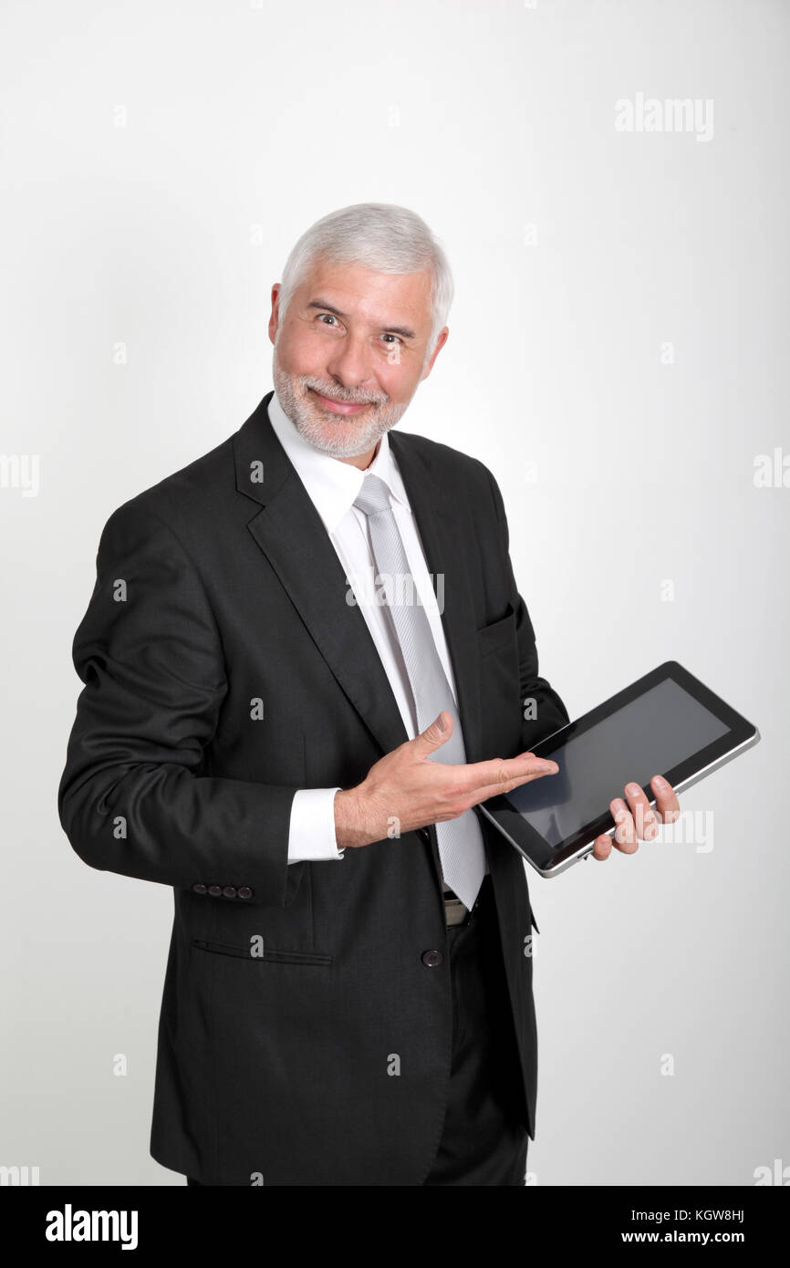 Businessman using electronic tablet Stock Photo - Alamy