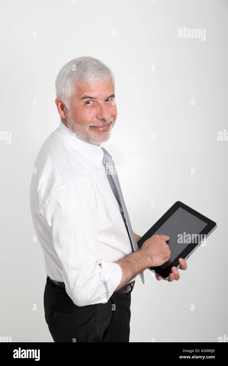 Businessman using electronic tablet Stock Photo - Alamy