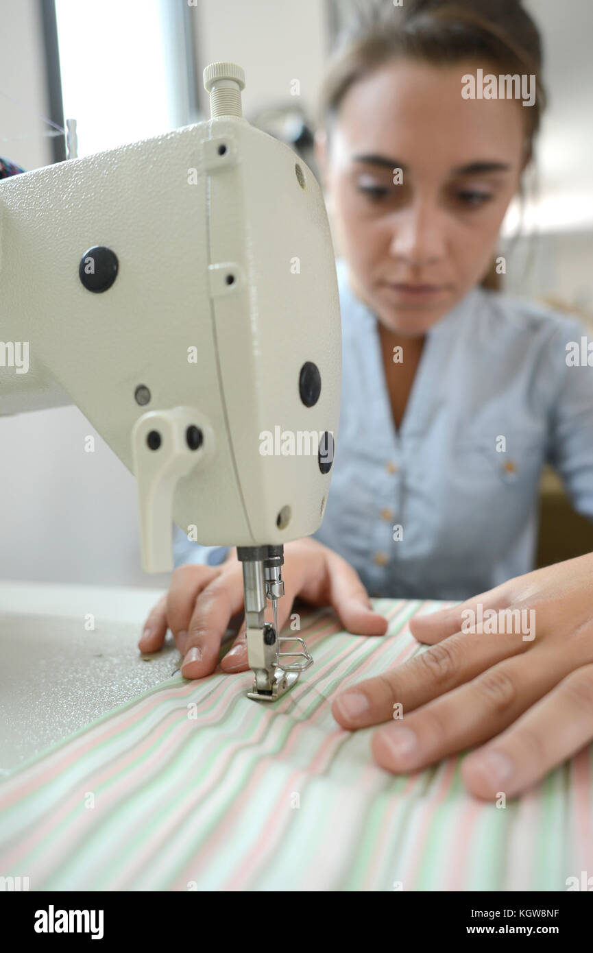 Closeup on sewing machine needle Stock Photo - Alamy