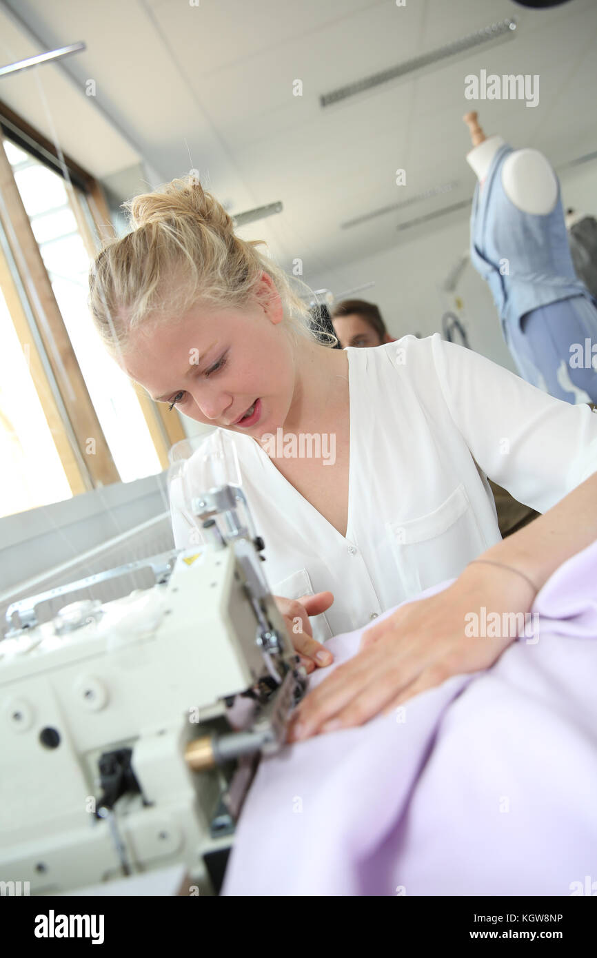 Young girl in sewing training course Stock Photo - Alamy