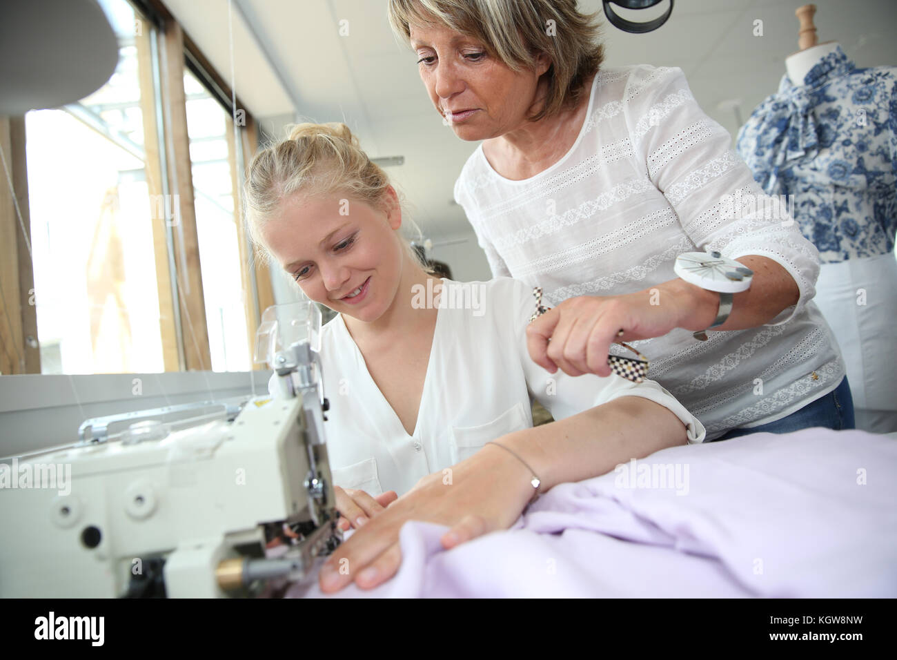 Student with teacher in dressmaking class Stock Photo - Alamy