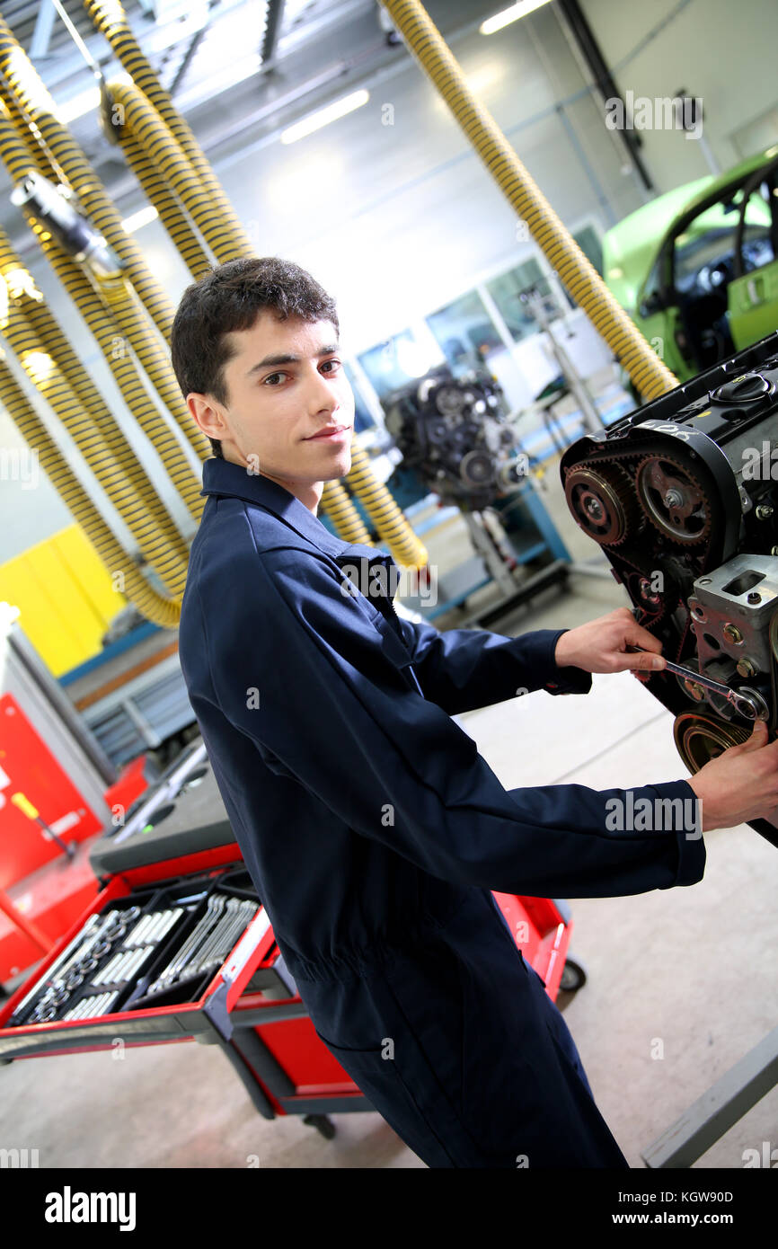Student in mechanics working on car engine Stock Photo - Alamy