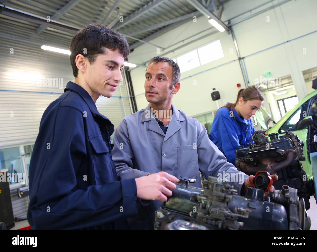 Mechanics training class with teacher and students Stock Photo - Alamy