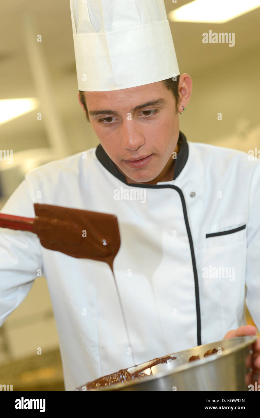 Pastry cook student making cake Stock Photo - Alamy