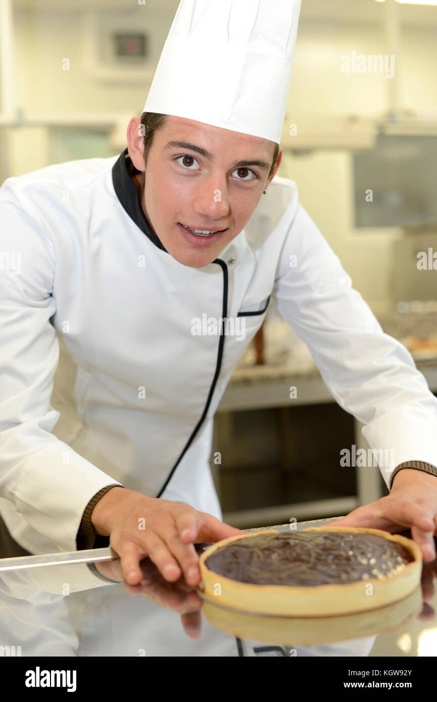 Pastry cook student making cake Stock Photo - Alamy