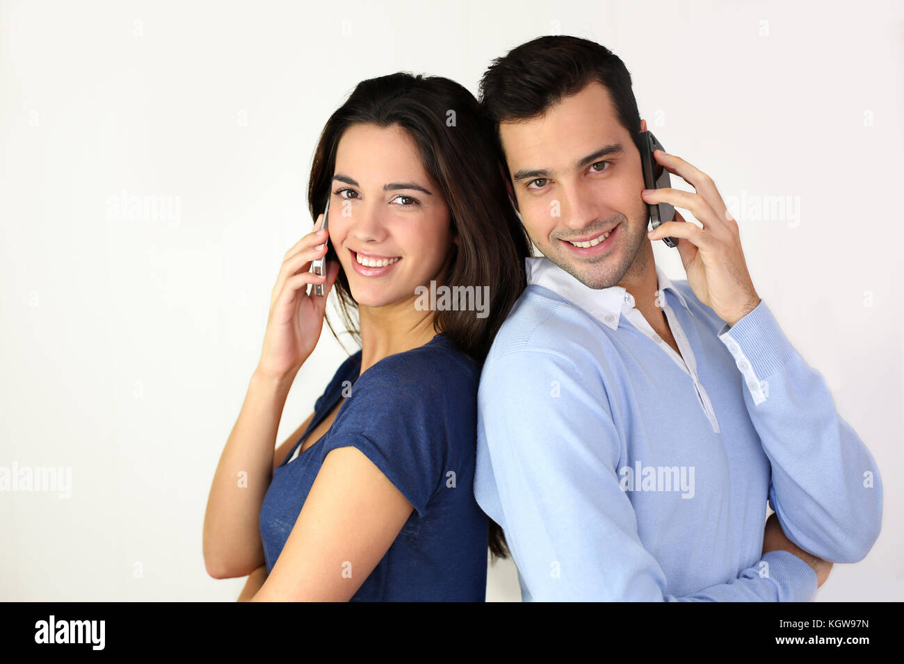 Couple talking on the mobilephone Stock Photo - Alamy