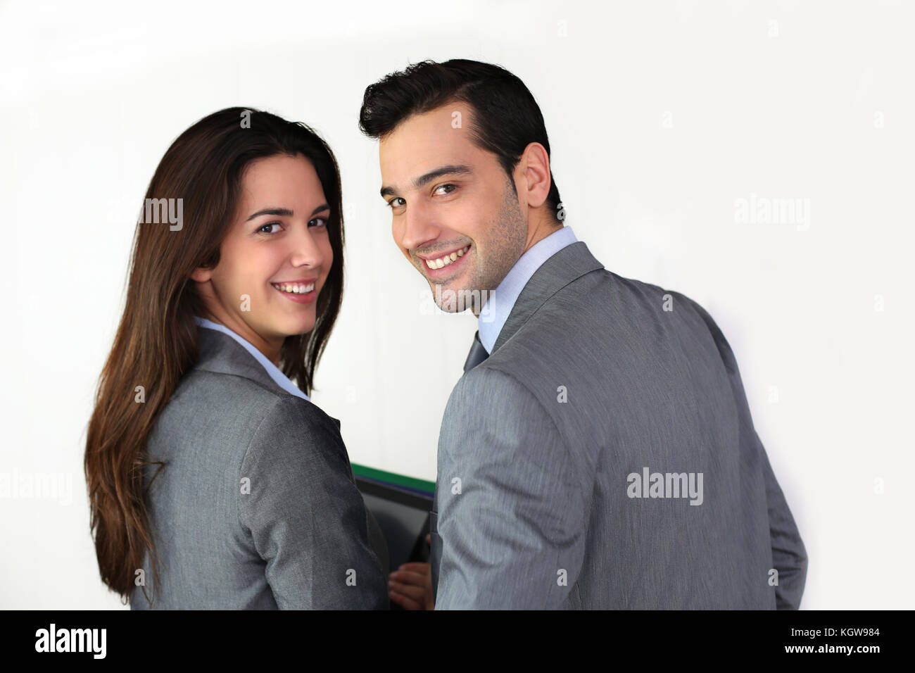 Portrait of smiling business people in grey suit Stock Photo - Alamy