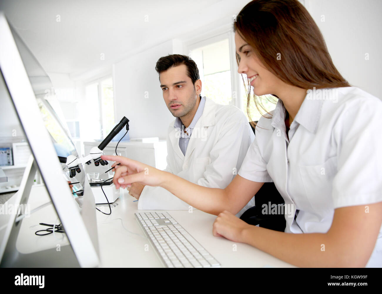 Students working on desktop computer in laboratory Stock Photo - Alamy