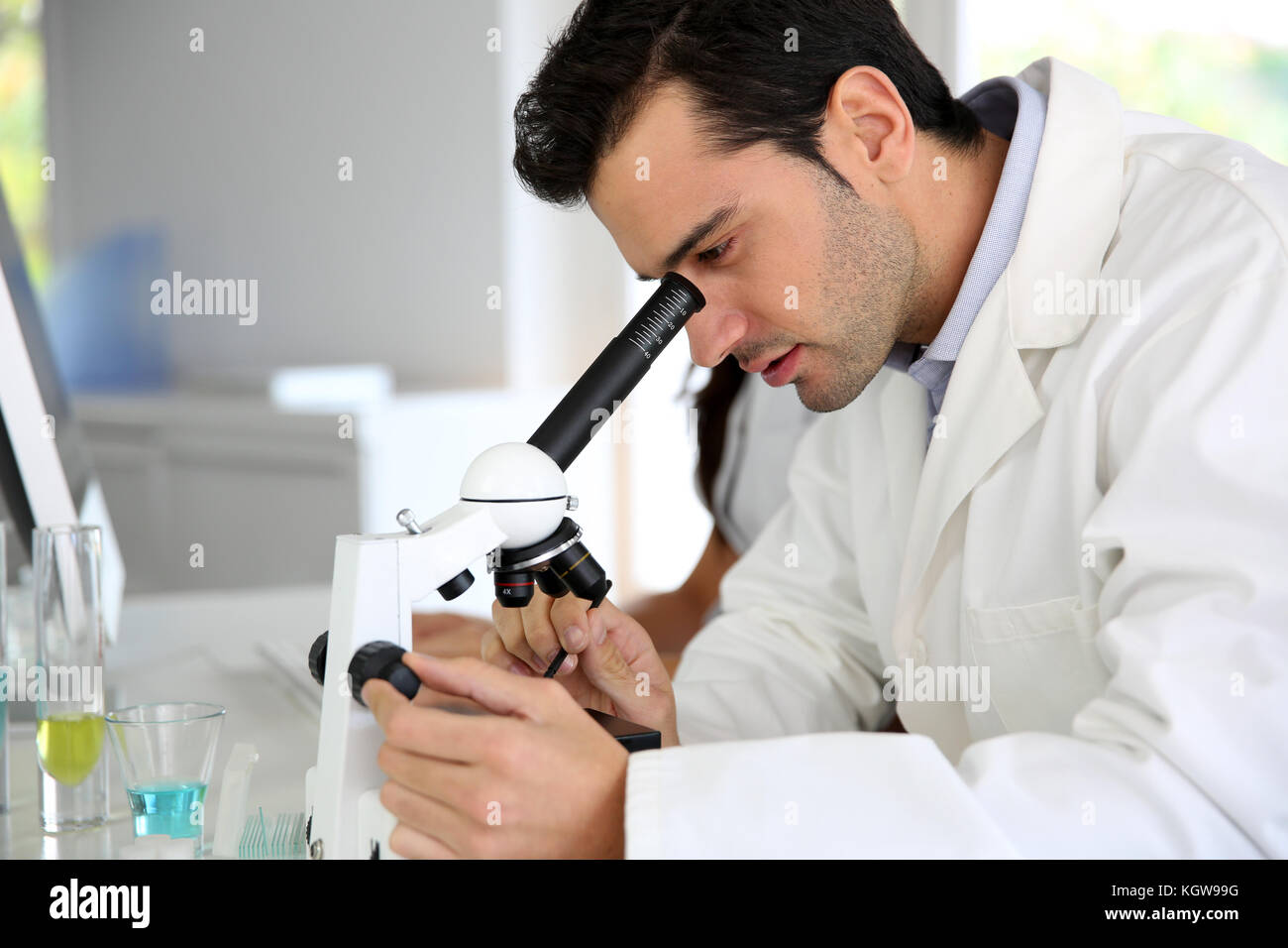 Doctor in biology working on microscope Stock Photo - Alamy