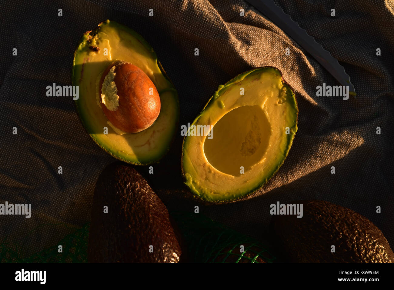 ripe avocado cut in half Stock Photo - Alamy