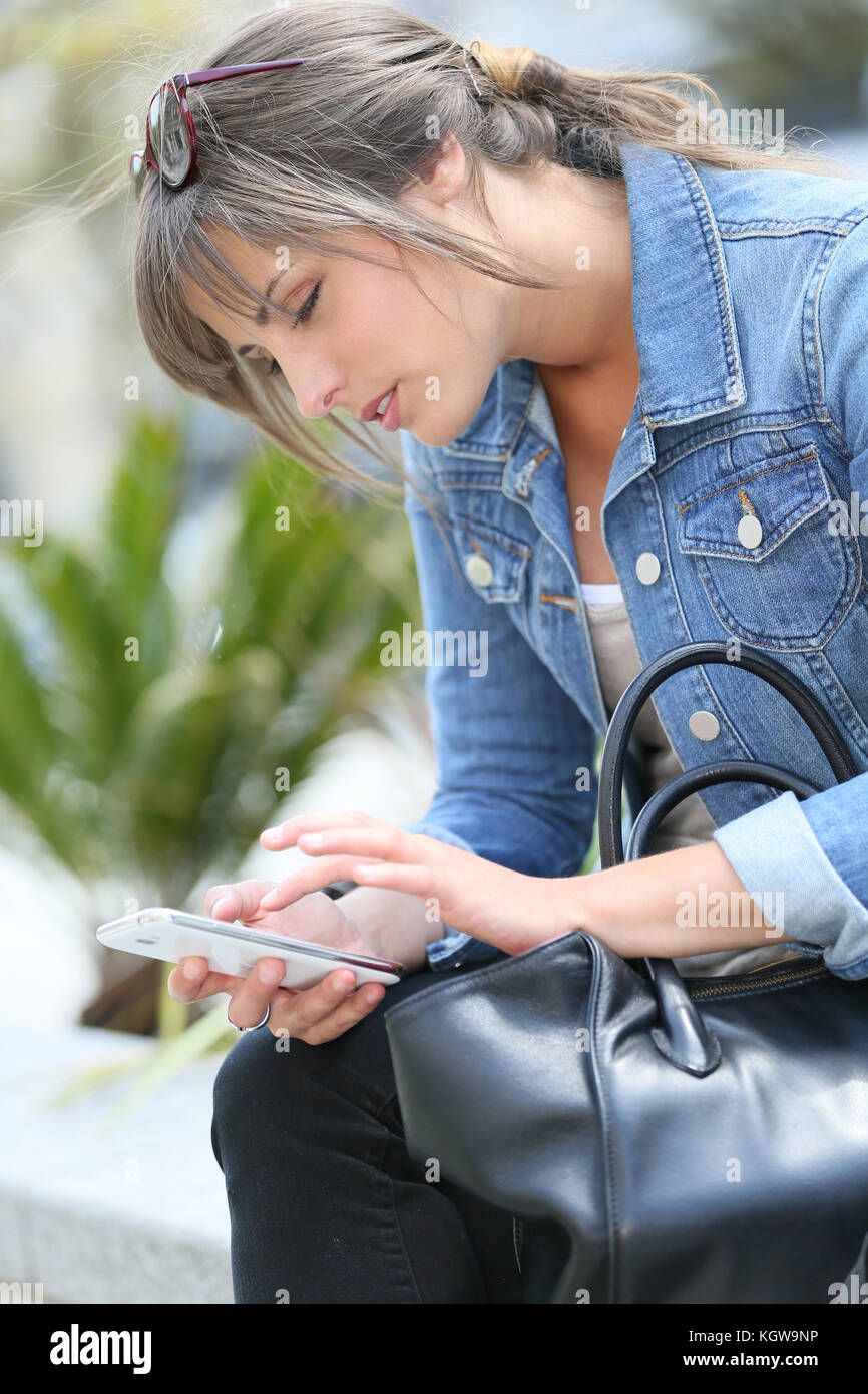 City girl in the street using smartphone Stock Photo - Alamy