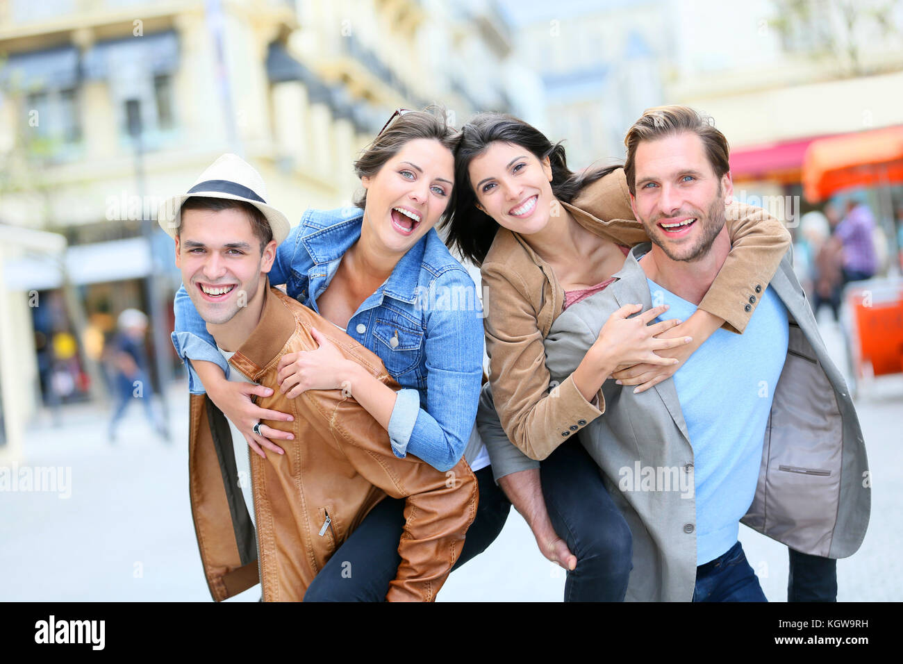 Group of friends getting silly in shopping street Stock Photo - Alamy