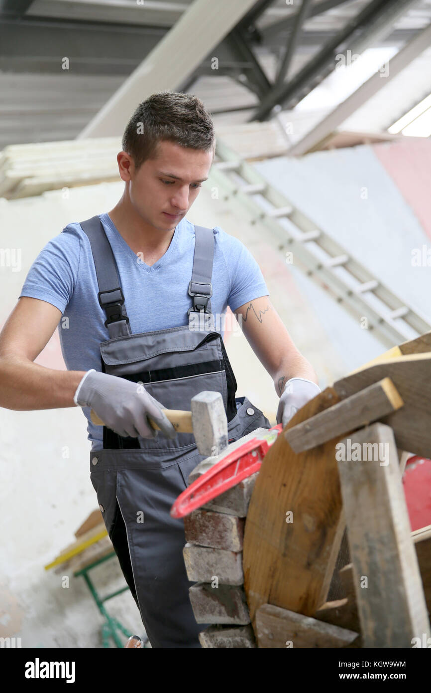 Young man in masonry professional school Stock Photo - Alamy