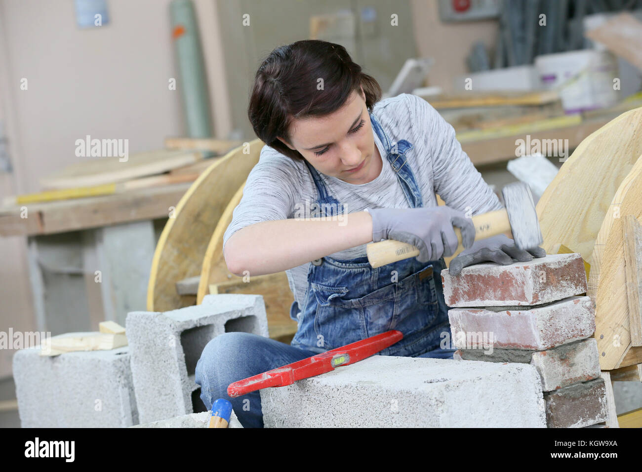 Young woman in masonry professional school Stock Photo - Alamy